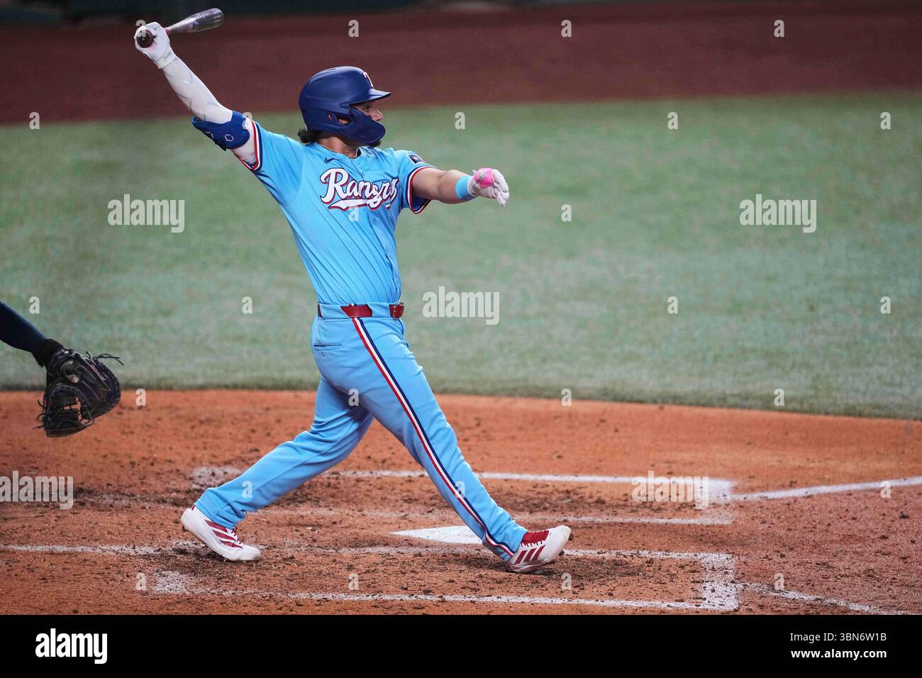 Texas Rangers' Alejandro Osuna follows through on a swing during a ...