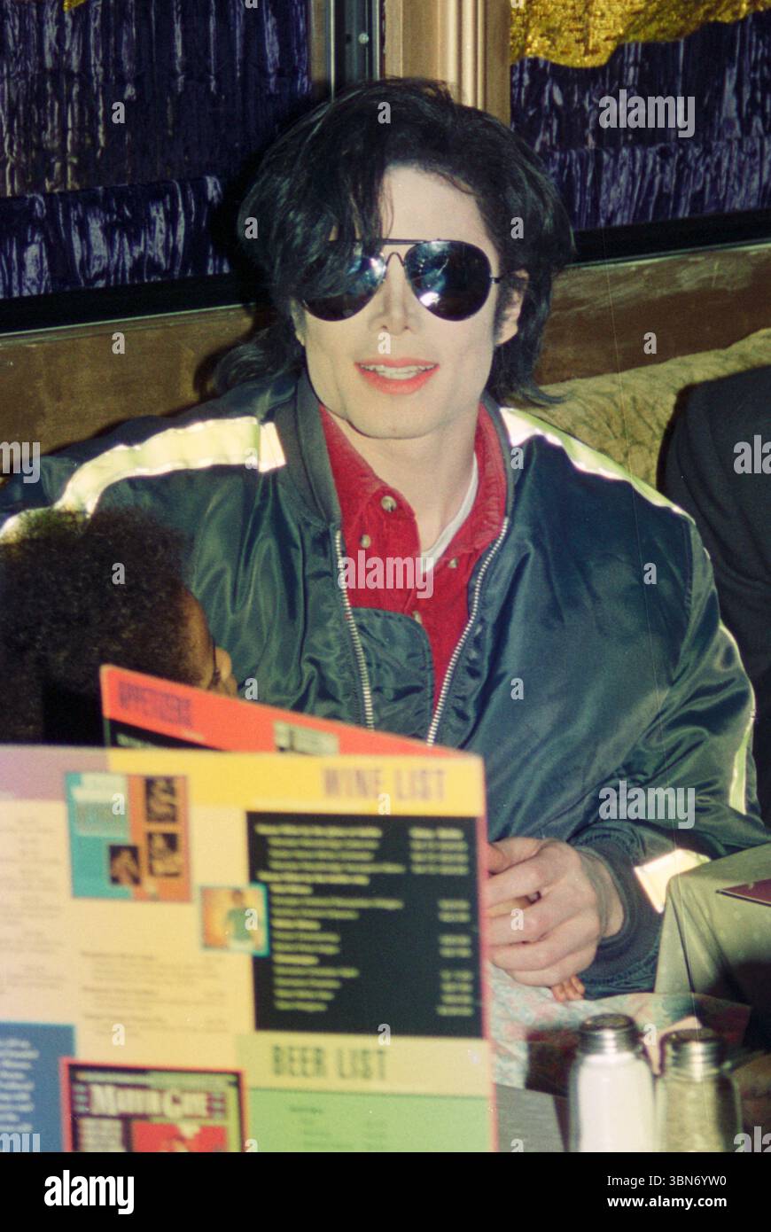 Michael Jackson holding a one year old girl, Juelle Dixson (whose ...