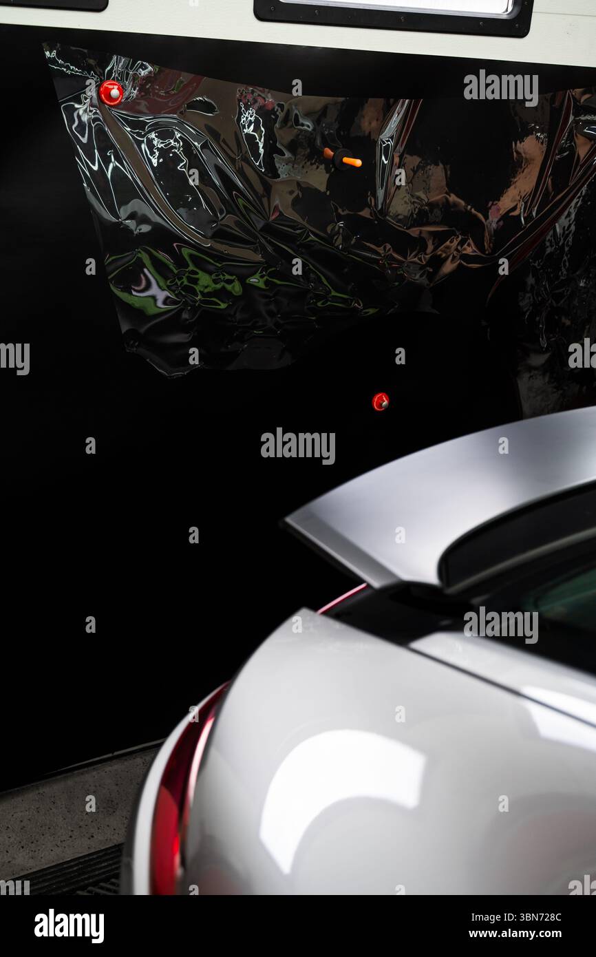 Vinyl wrap is manually cut using stencil over the film for precise ...