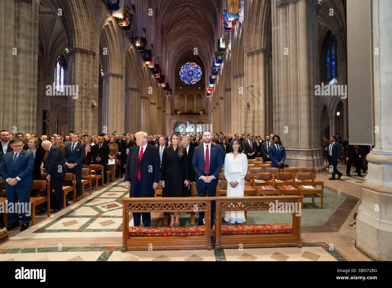 President Donald Trump and First Lady Melania Trump stand with guests ...