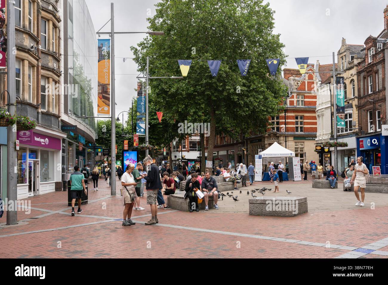 Shoppers and visitors to Reading town centre on the pedestrianised ...