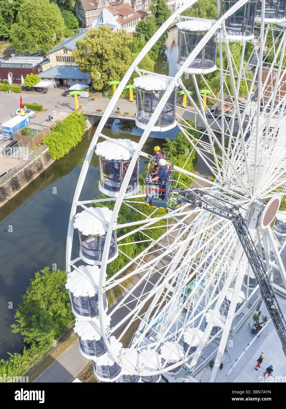 Aerial view of Ferris wheel and emergency services, fire brigade ...