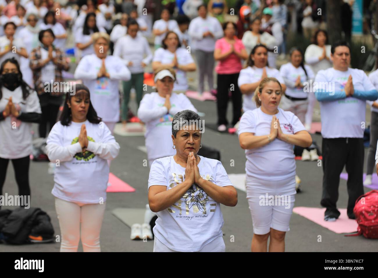 A woman takes part during a Yoga mass class at Angel of Independencia ...