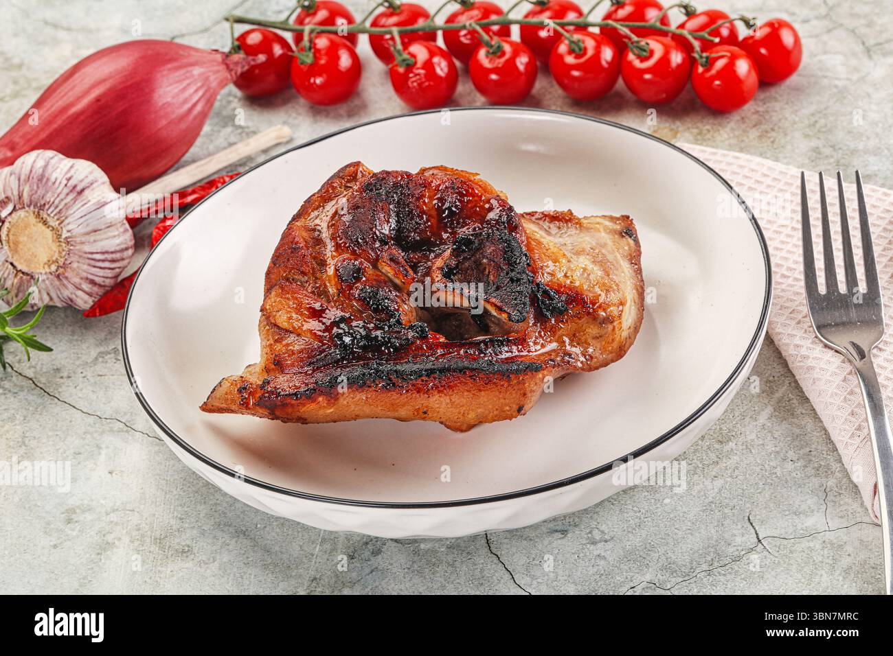 Roasted pork knuckle steak with bone Stock Photo - Alamy