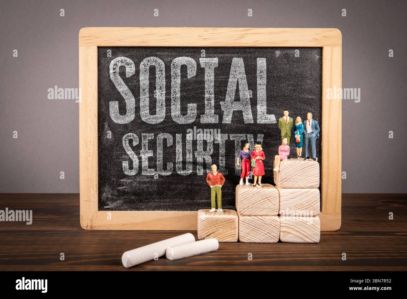 Social Security Concept with Chalkboard and Miniature People ...