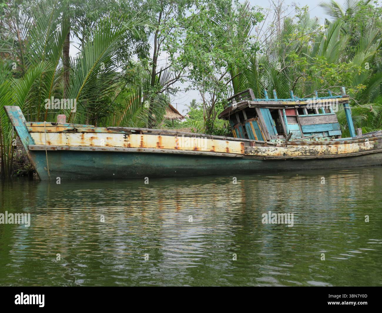 An old boat in the jungle on the Praek Tuek Chhu River in Kampot ...