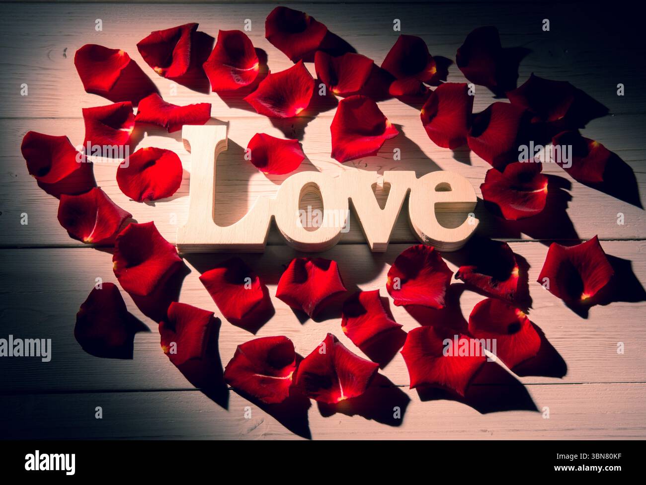 Wooden Love cutout is resting on flat illustration wood surface, with ...