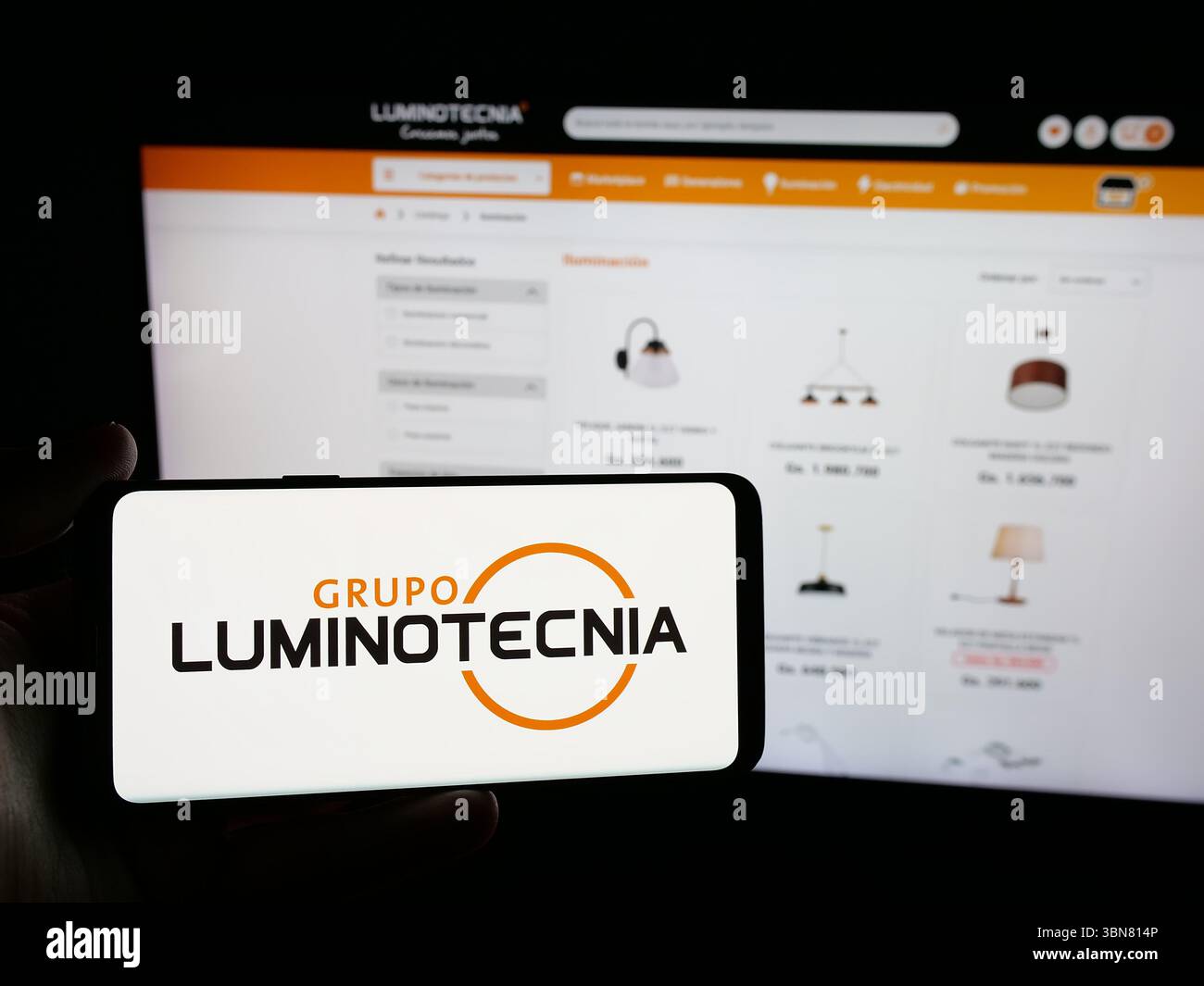 Stuttgart, Germany - 05-04-2025: Person holding smartphone with logo of Paraguayan company Grupo ...