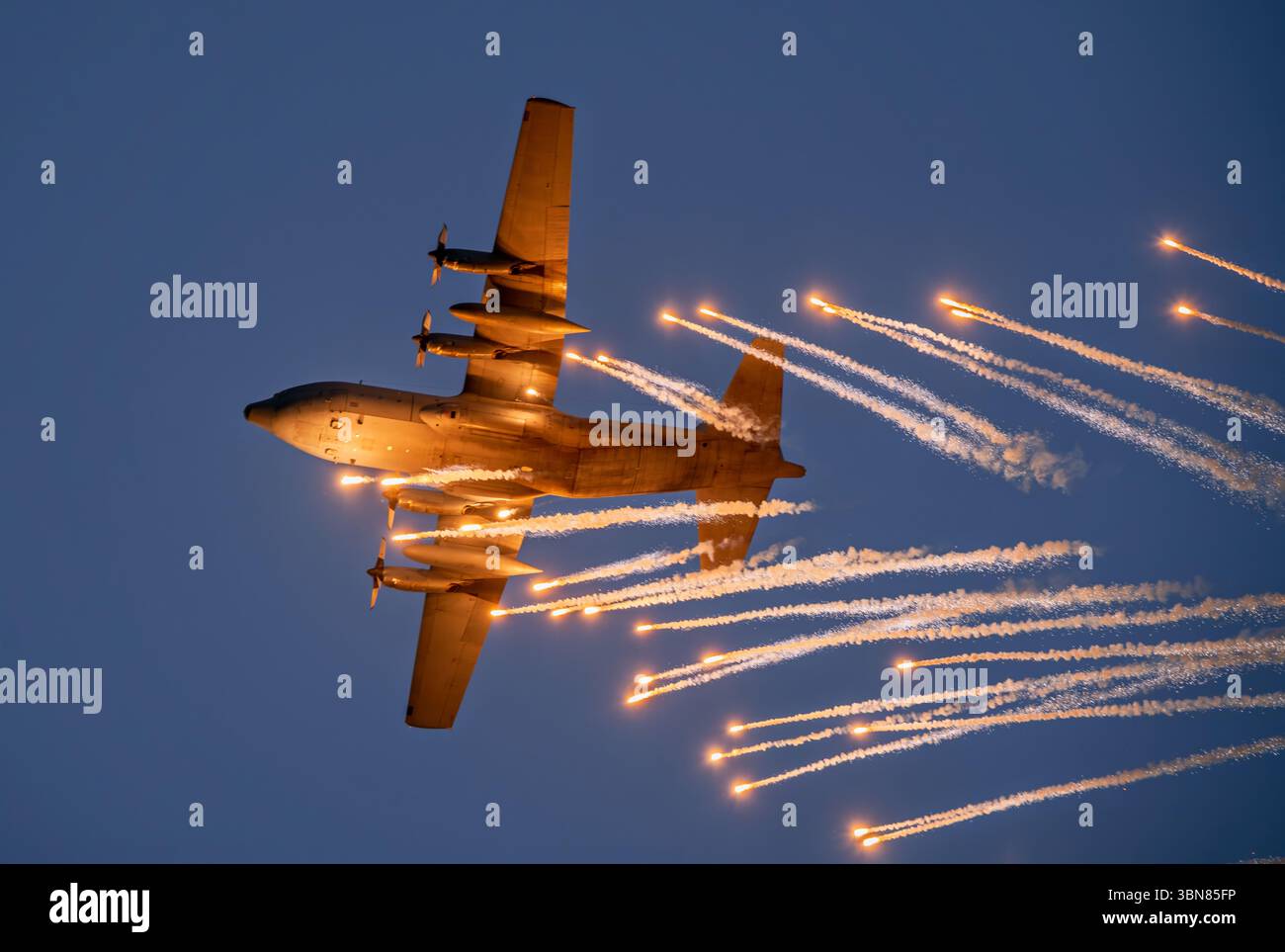 Military transport aircraft during a night combat flight Stock Photo ...