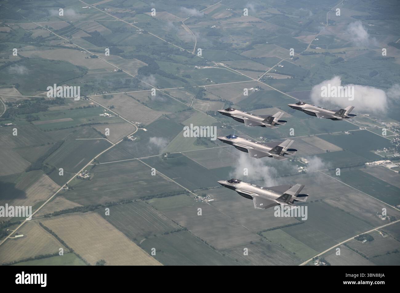 F-35 Lightning IIs fly in a formation over rural Wisconsin June 23 ...