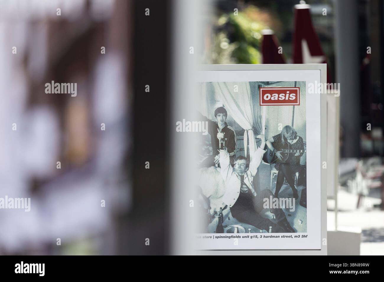 Manchester, UK - 26 June 2025: Oasis album cover artwork on display ...