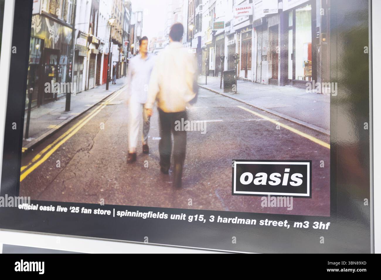 Manchester, UK - 26 June 2025: Oasis album cover artwork on display ...