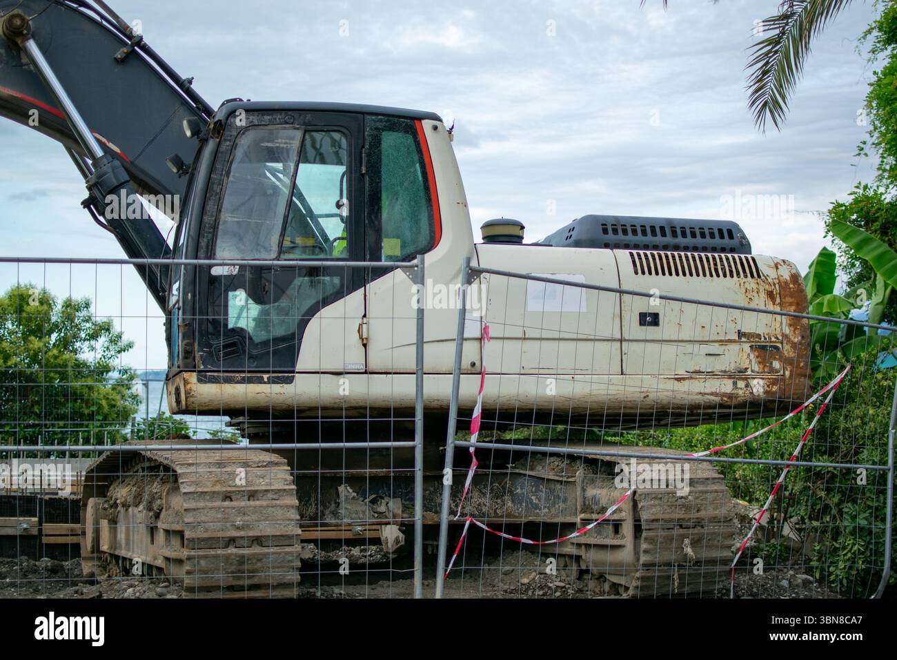 Excavator Scooping Soil and Rocks in Outdoor Construction Zone Stock ...