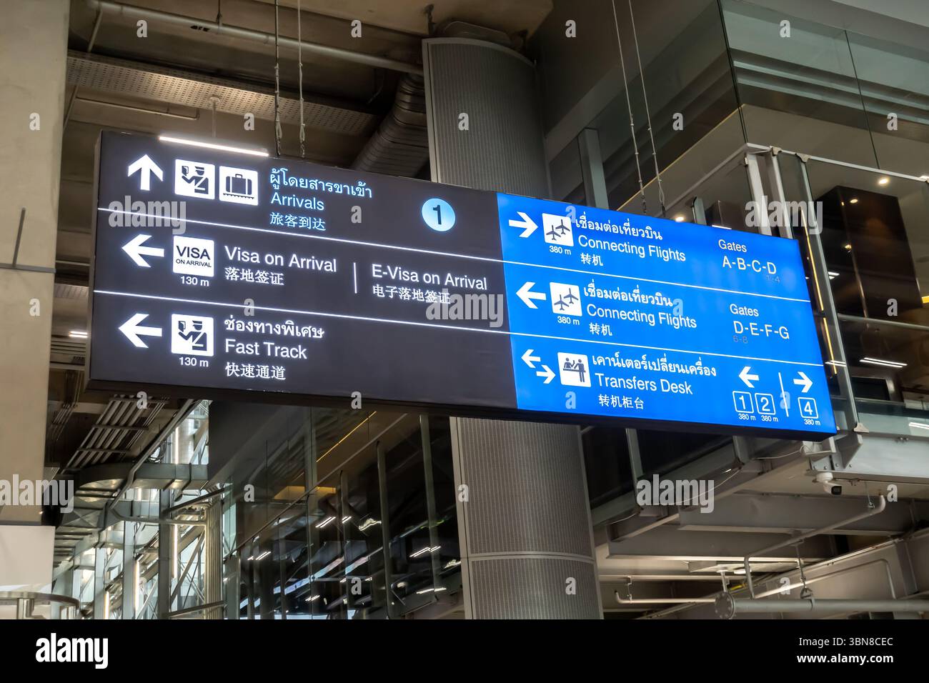 Arrivals terminal directional signs in Bangkok Airport, thailand Stock ...