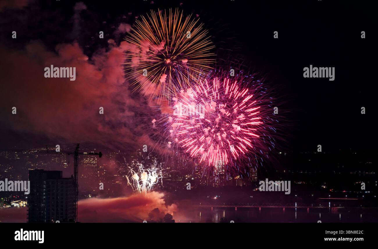 Fireworks explode above the Ottawa River and LeBreton Flats Park on ...