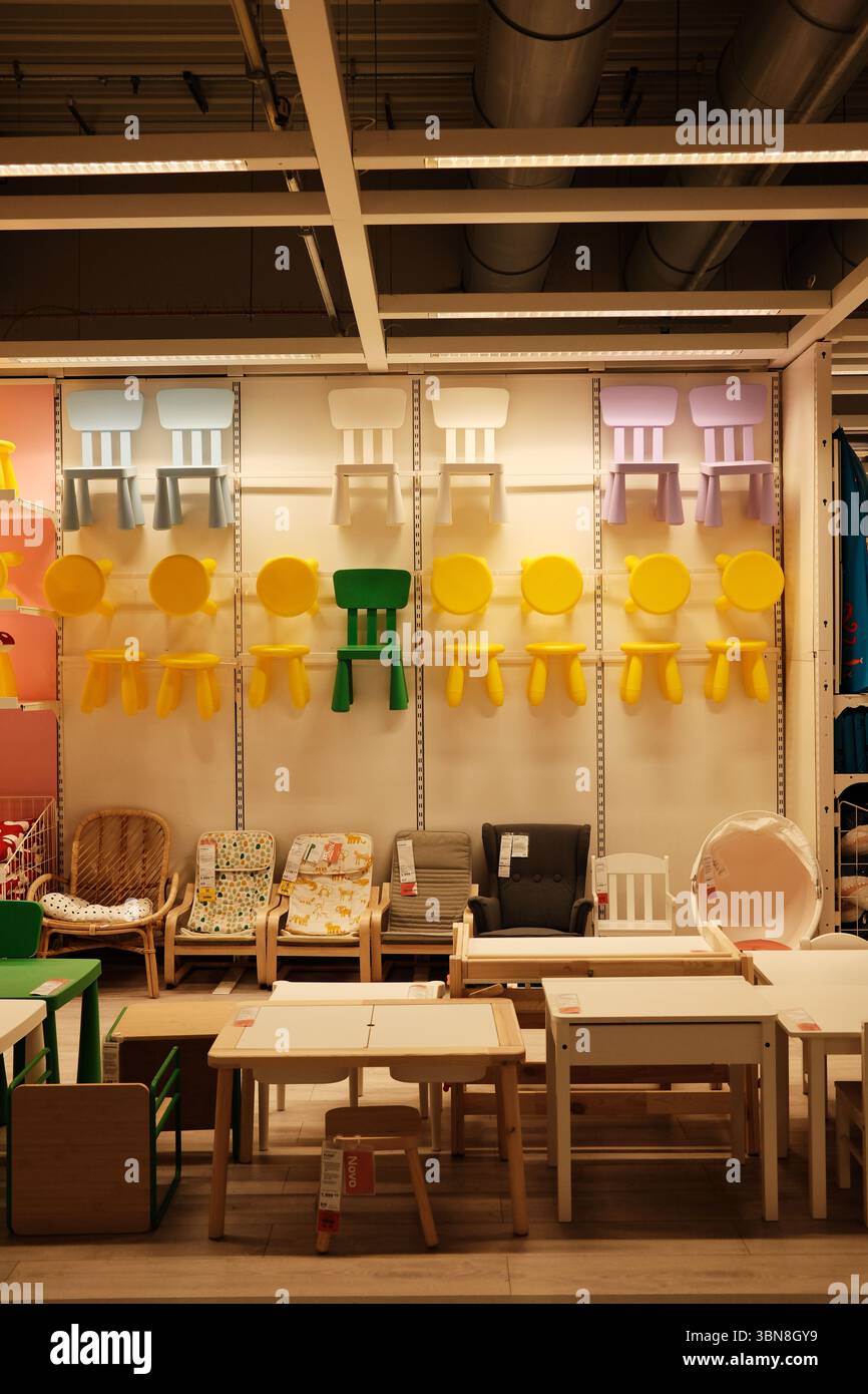 Bright IKEA display of colorful childrens chairs and stools arranged on ...