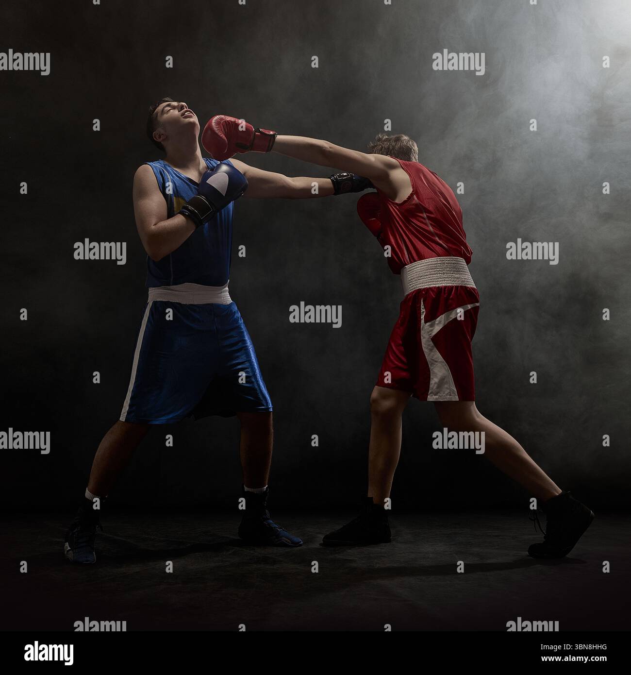 Two boxers in mid-fight exchanging punches intense competition dark ...