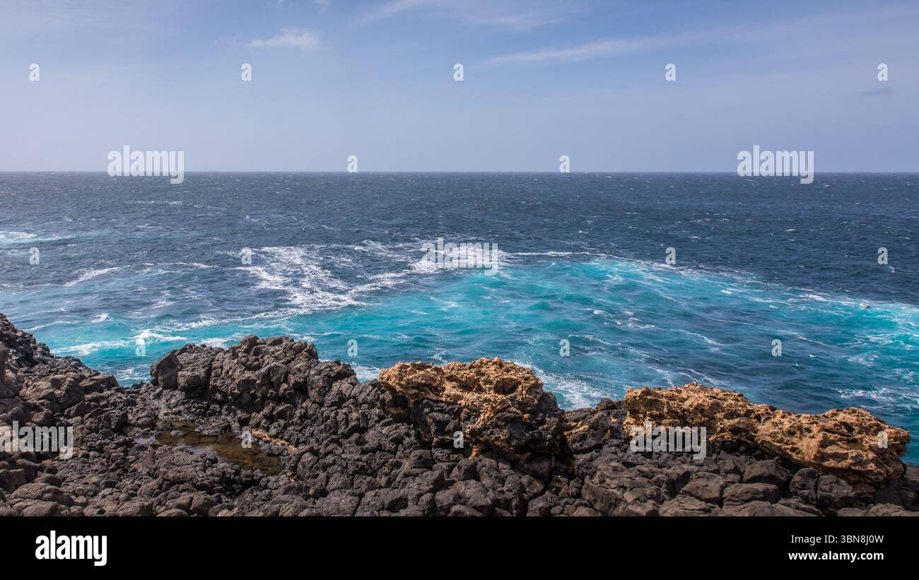 Black volcanic rocks wave hi-res stock photography and images - Alamy