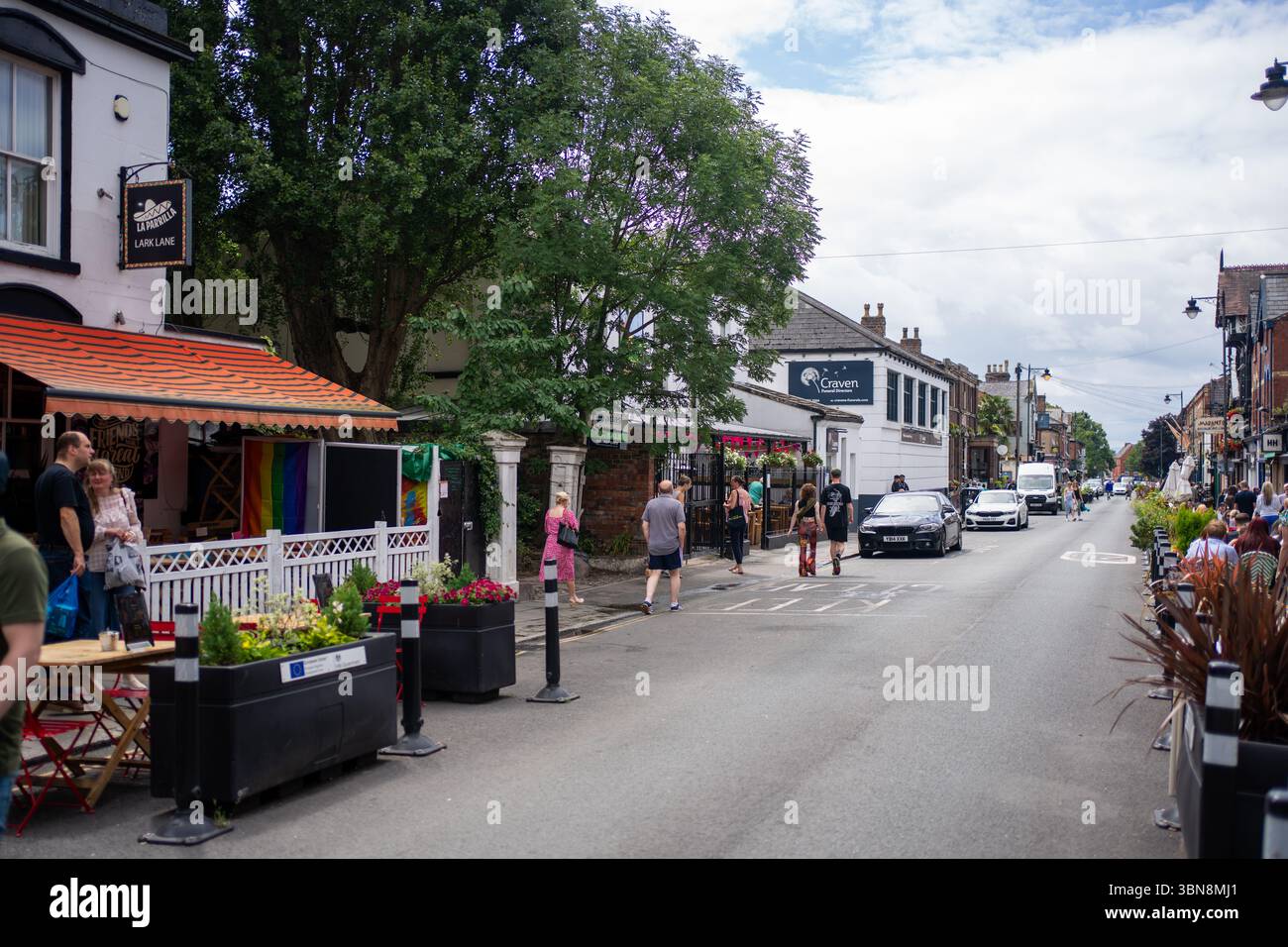 Shops, cafes and restaurants line Lark Lane off Sefton Park, in ...