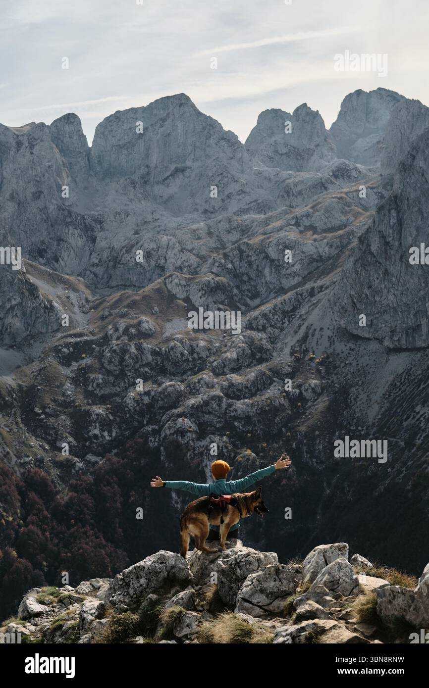 Female traveler raises arms hi-res stock photography and images - Alamy