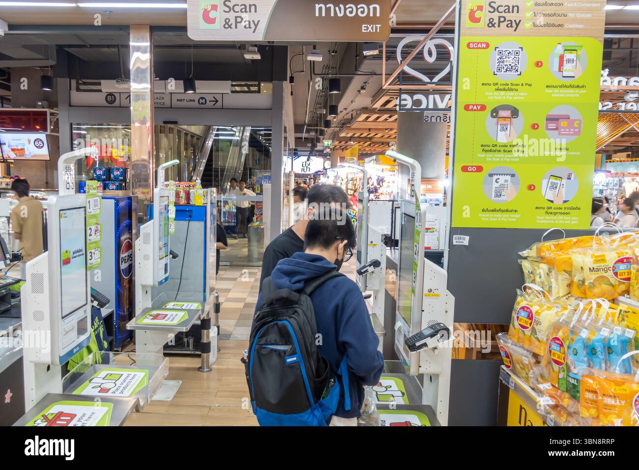 Big C supermarket, Bangkok, Thailand, A customer uses a self-checkout ...