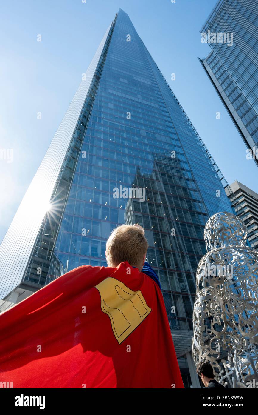 London, UK. 1 July 2025. Superman fan Matt Hessey from Kent dons a red ...
