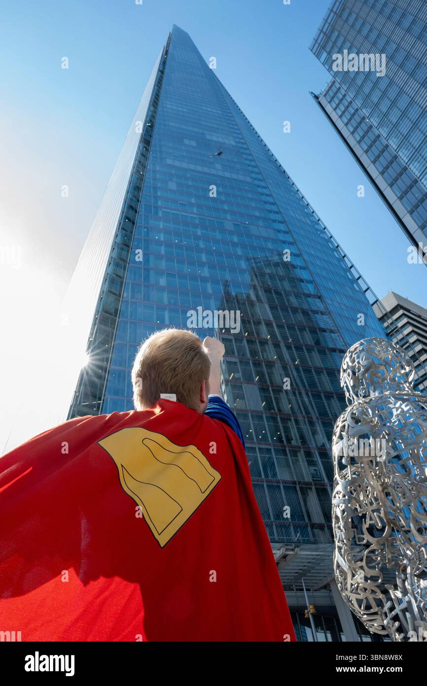 London, UK. 1 July 2025. Superman fan Matt Hessey from Kent dons a red ...