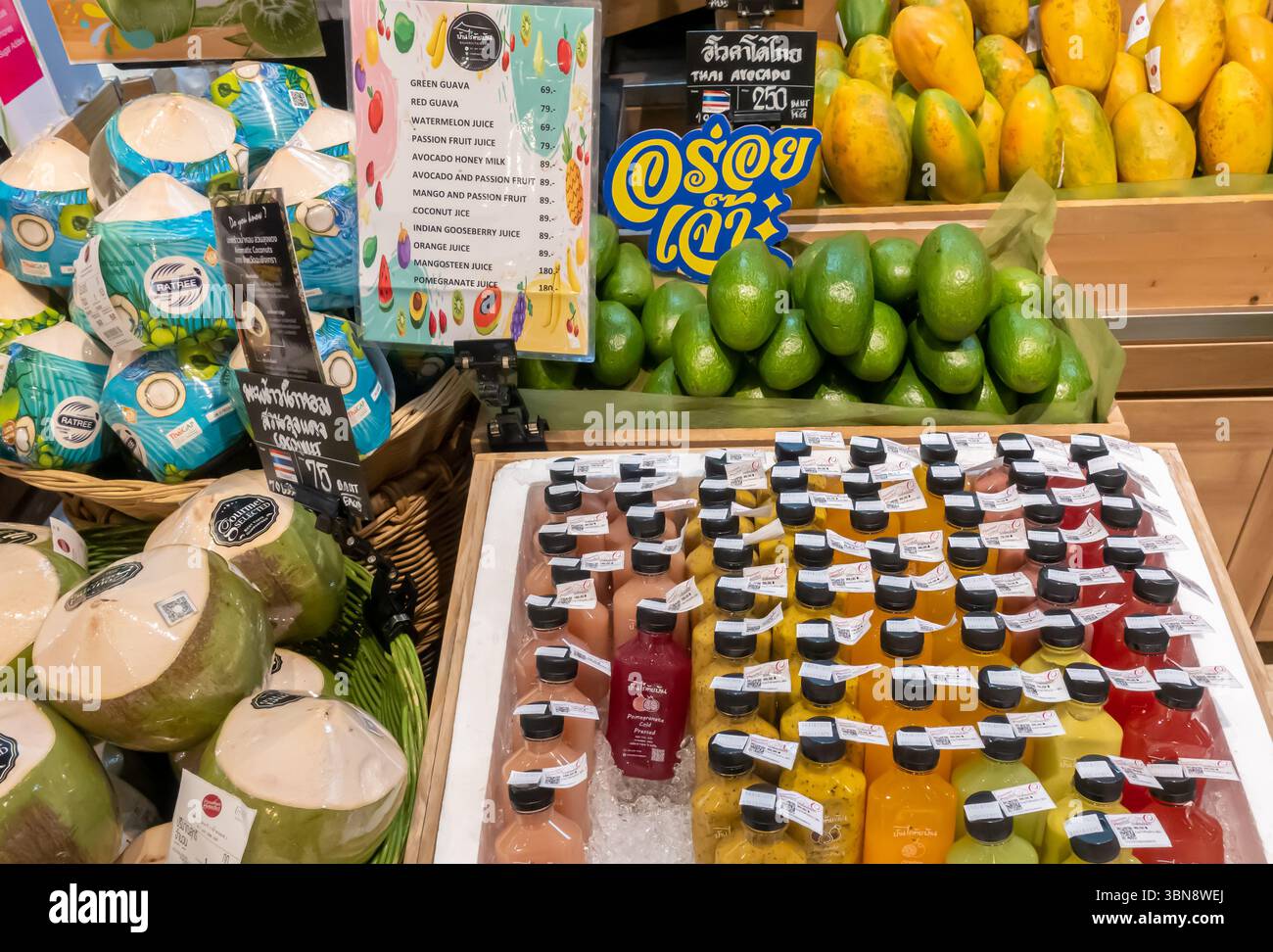 a variety of fresh fruits and bottled beverages, including coconuts ...