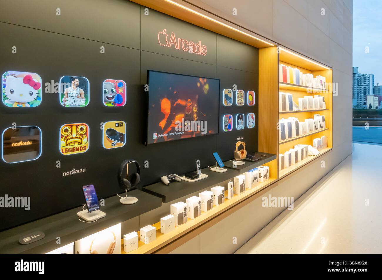 A display of Apple products and Apple Arcade games sits beneath a large ...