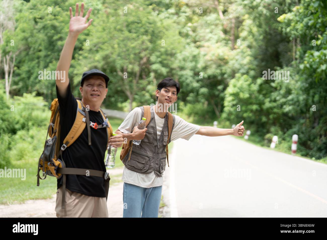 Father and Son on Hiking Trip. Two men waving and enjoying their ...