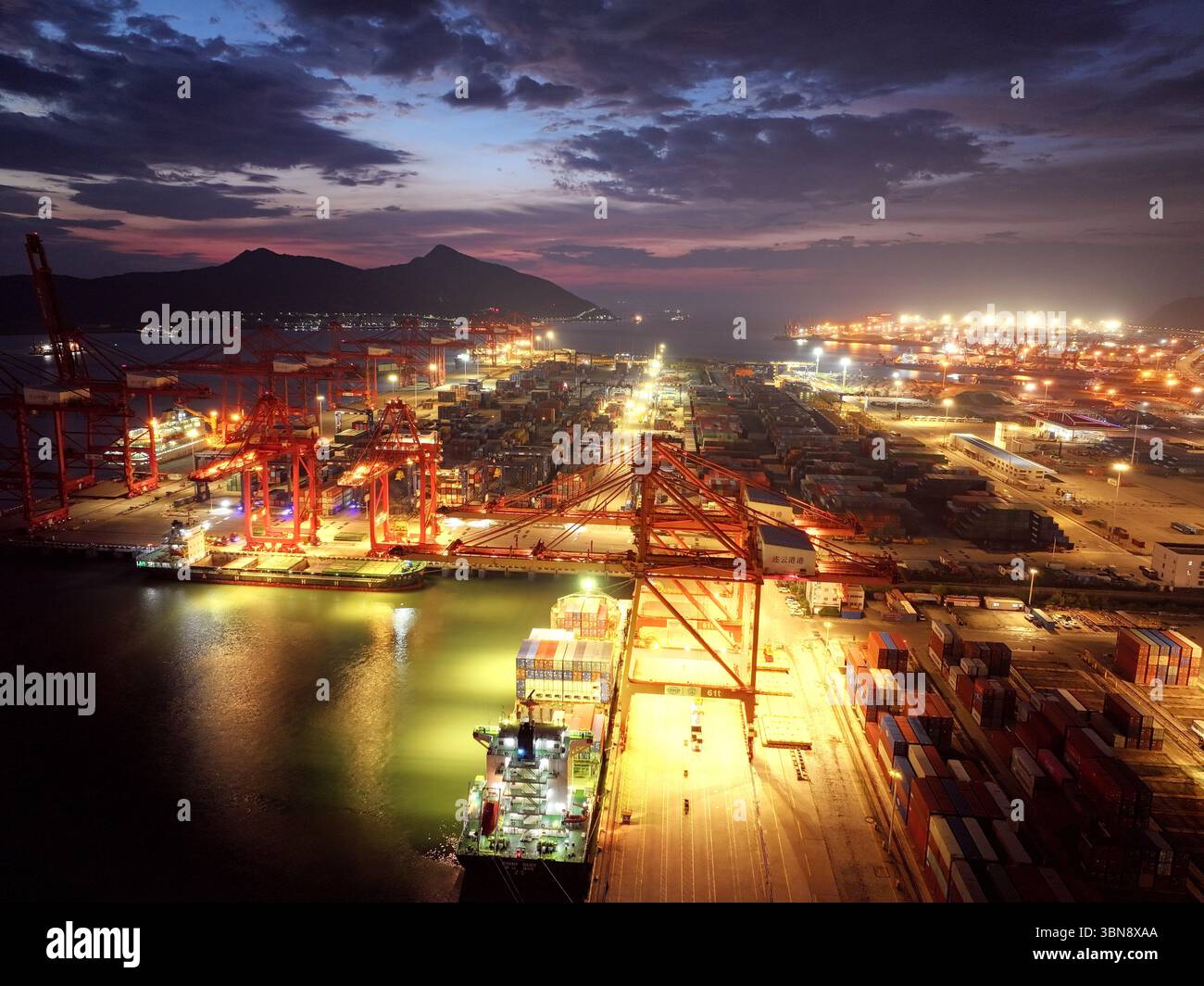 Aerial photo shows the container terminal of Lianyungang Port at night ...