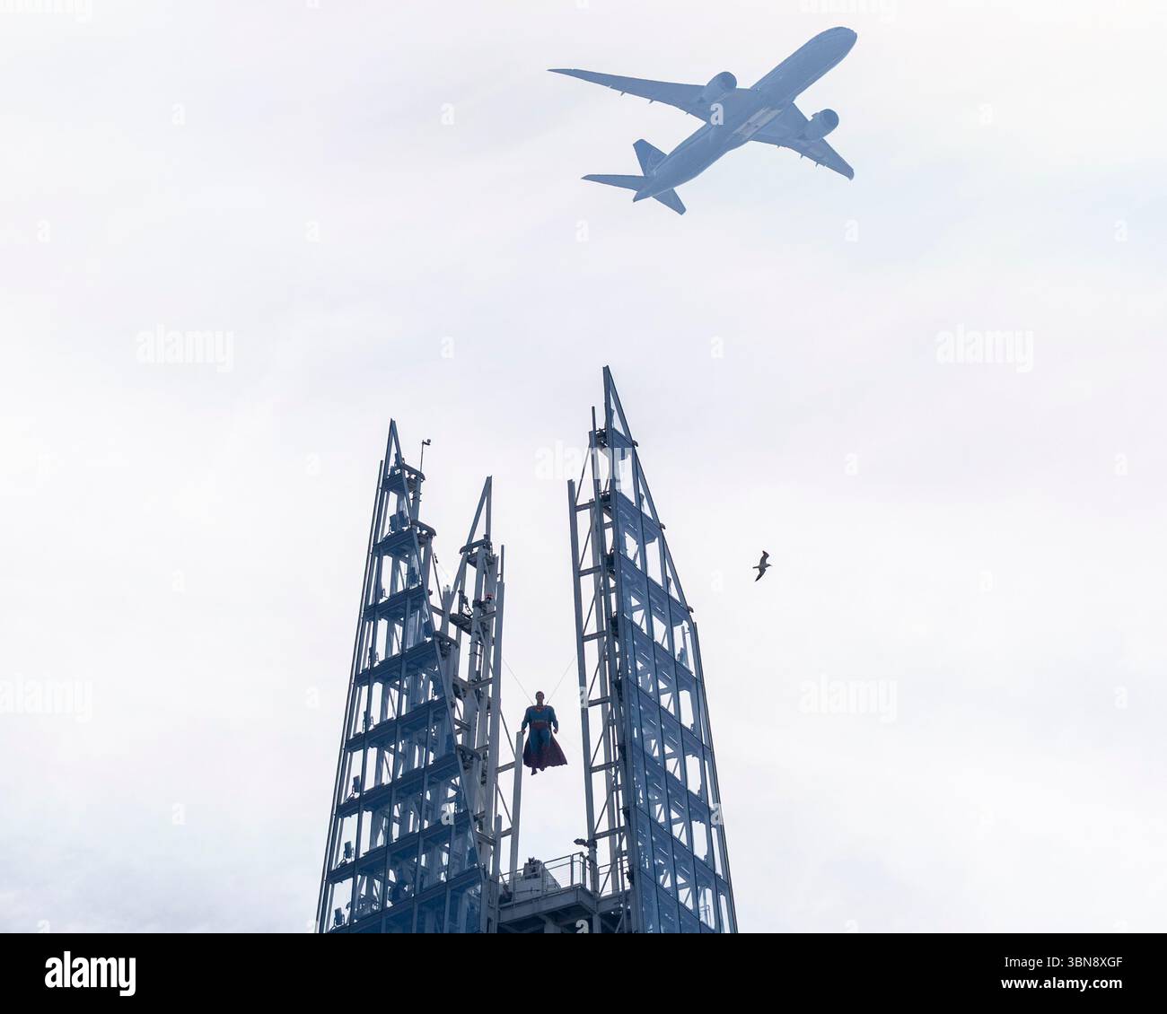 London, UK. 1 July 2025. A bird and aircraft fly past the life-like ...