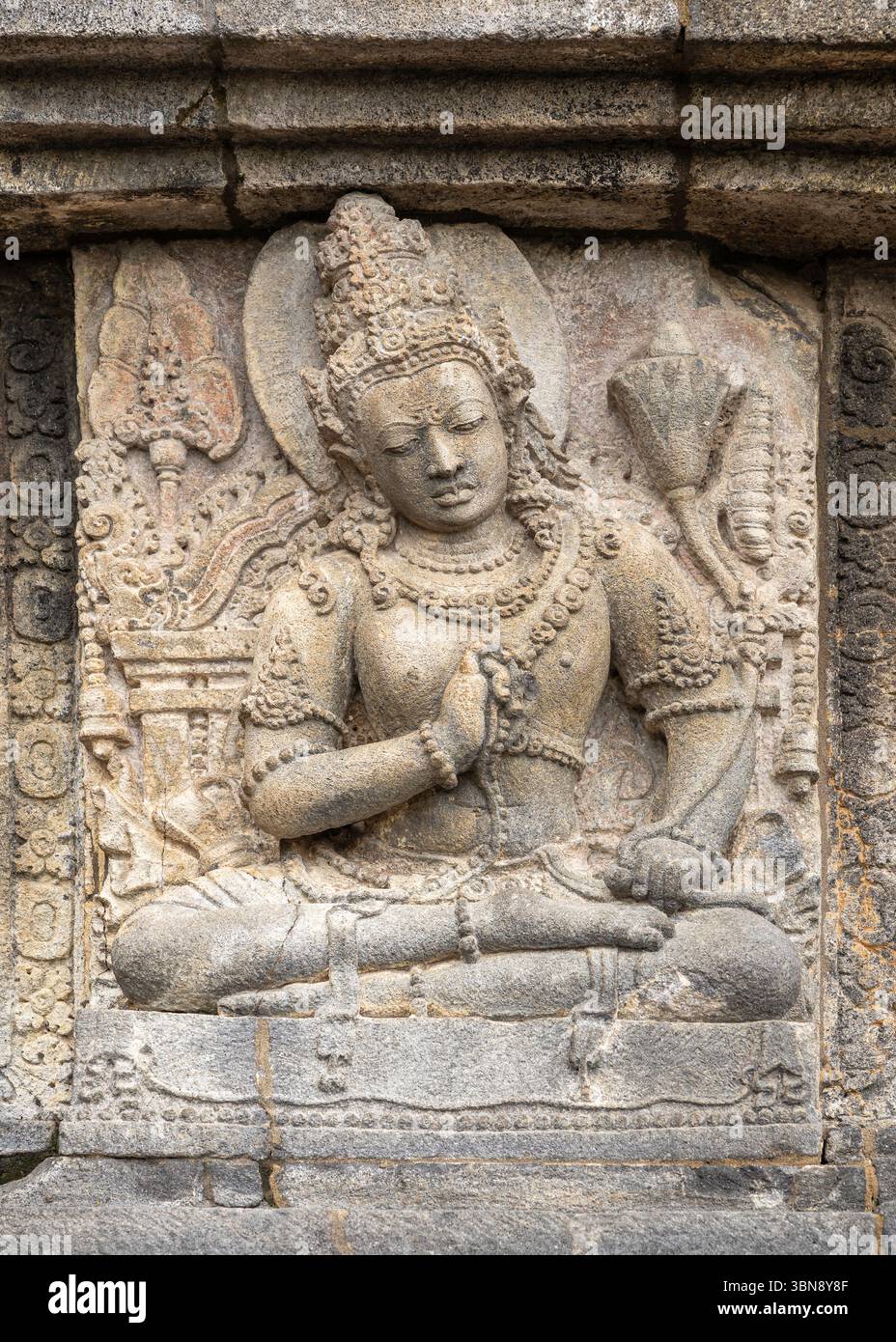 Closeup view of ancient stone bas-relief of lokapala god, Shiva hindu ...