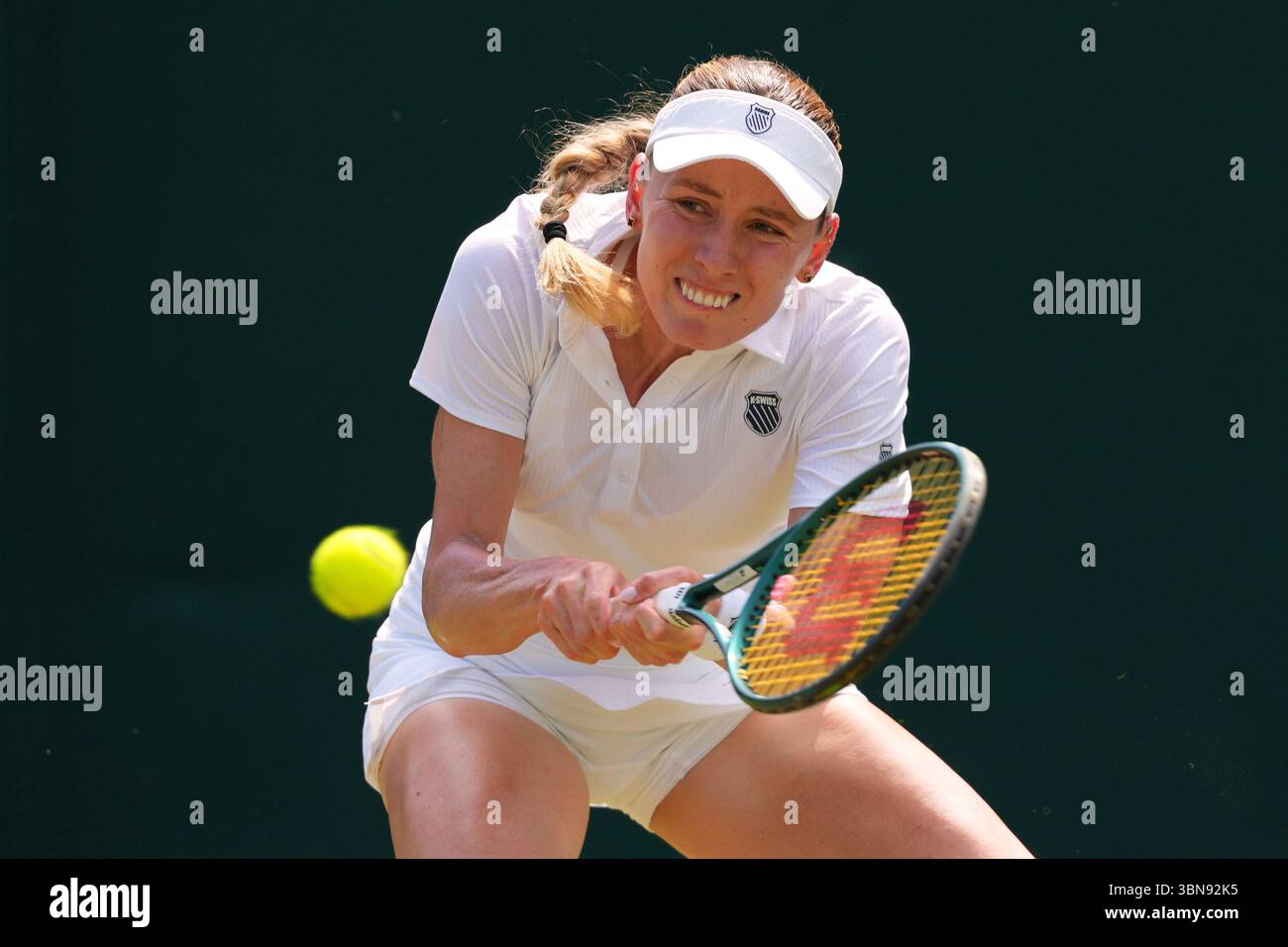 Ekaterina Alexandrova of Russia returns the ball to Priscilla Hon of ...