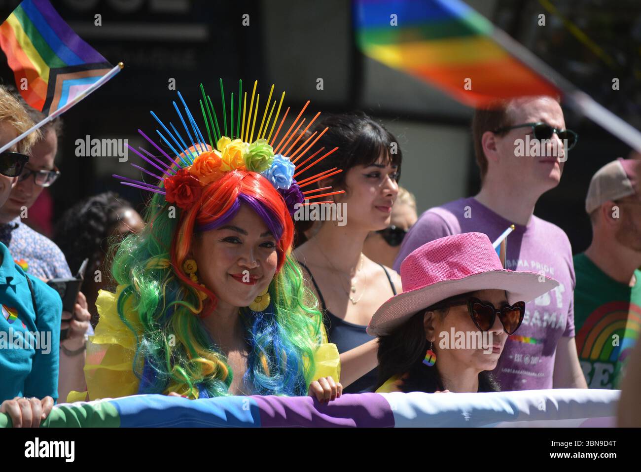 People marching down Fifth Avenue in the annual New York City Pride ...