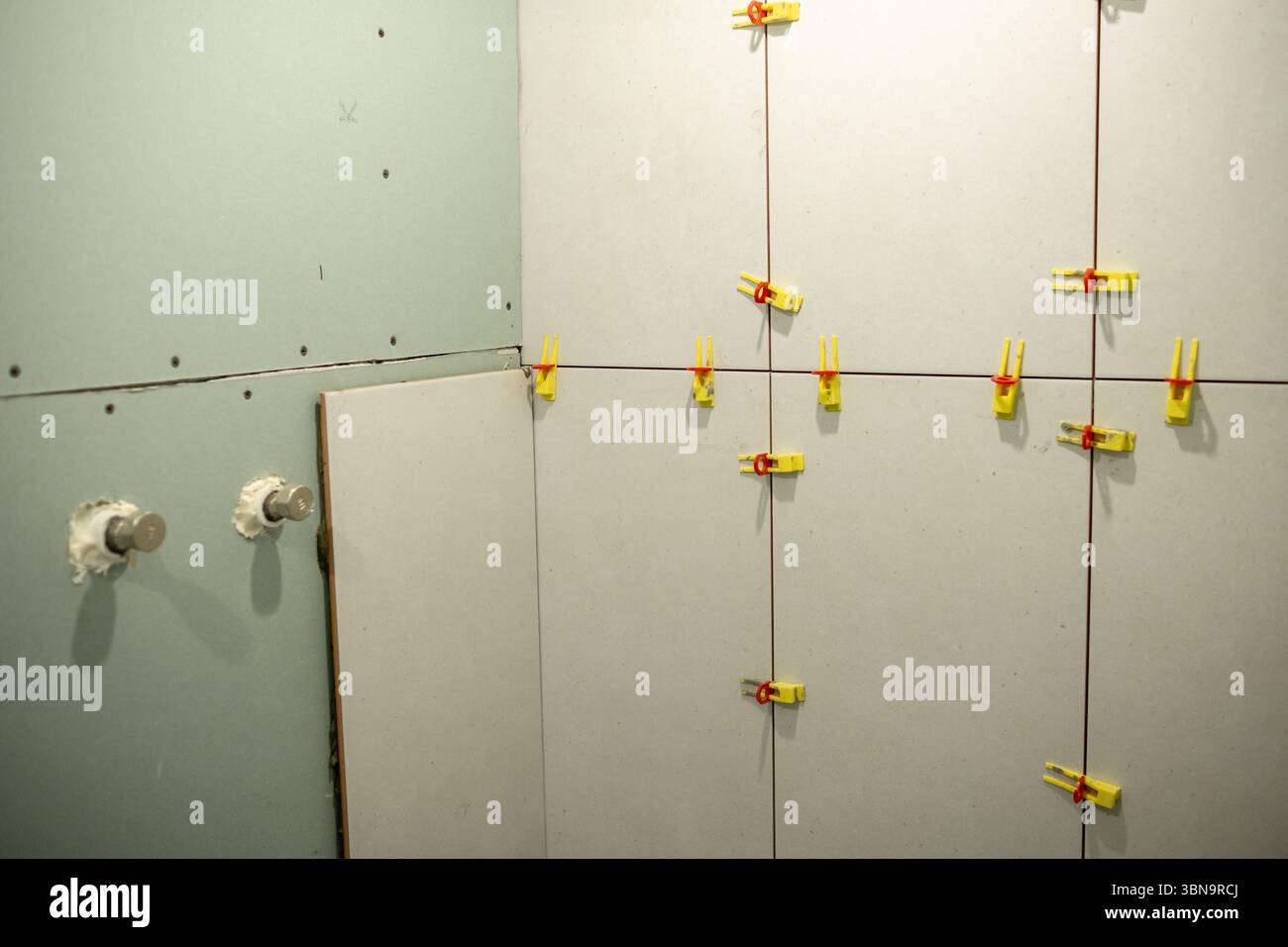 Wall Renovation Project in Progress With Clamps Securing Panels ...