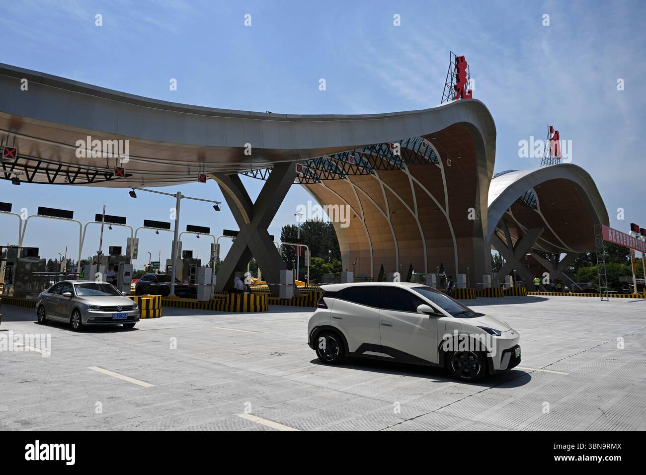 Wuhu, China's Anhui Province. 1st July, 2025. Vehicles pass through the ...