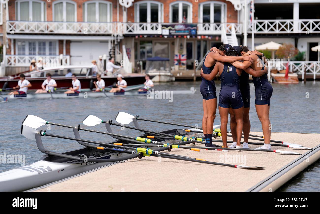 A crew from Belen Jesuit Preparatory School huddle together following ...