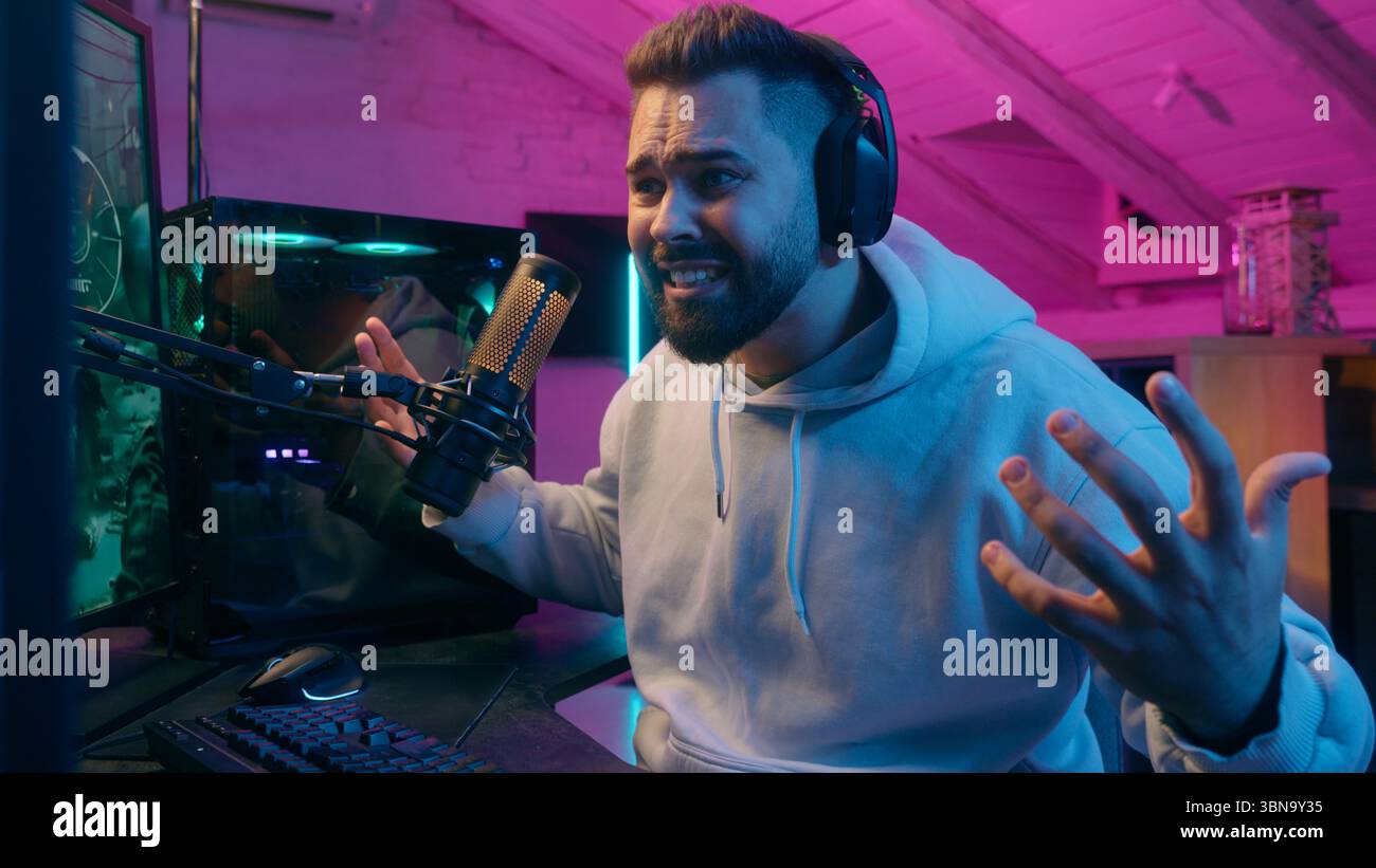 Smiling Caucasian man guy male gamer streamer playing online game at ...