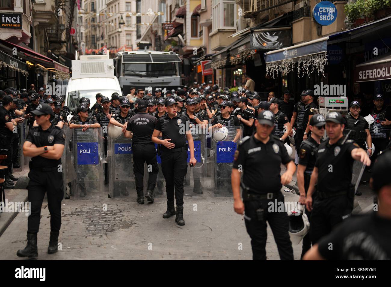 Police officers take position prior to a protest against satirical ...
