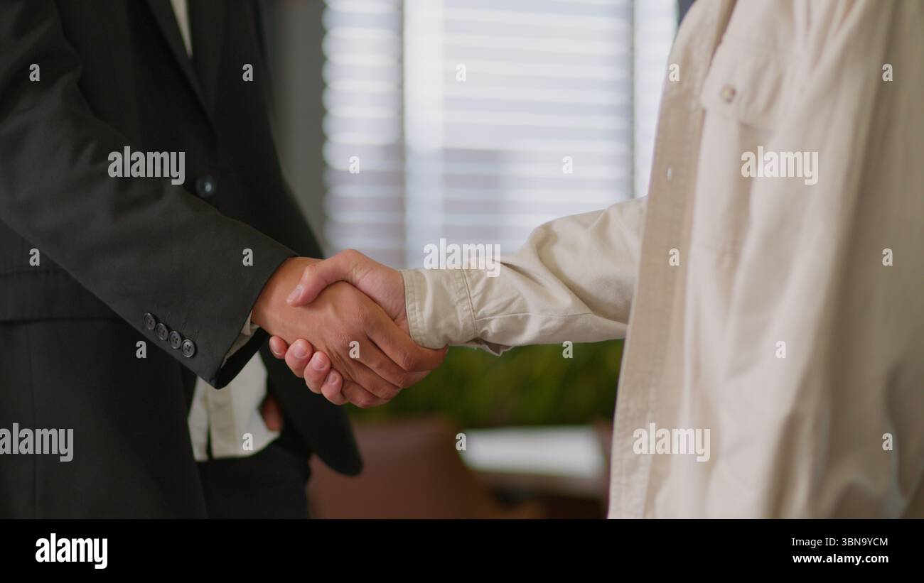 Business handshaking in office close up two businessmen shaking hands ...