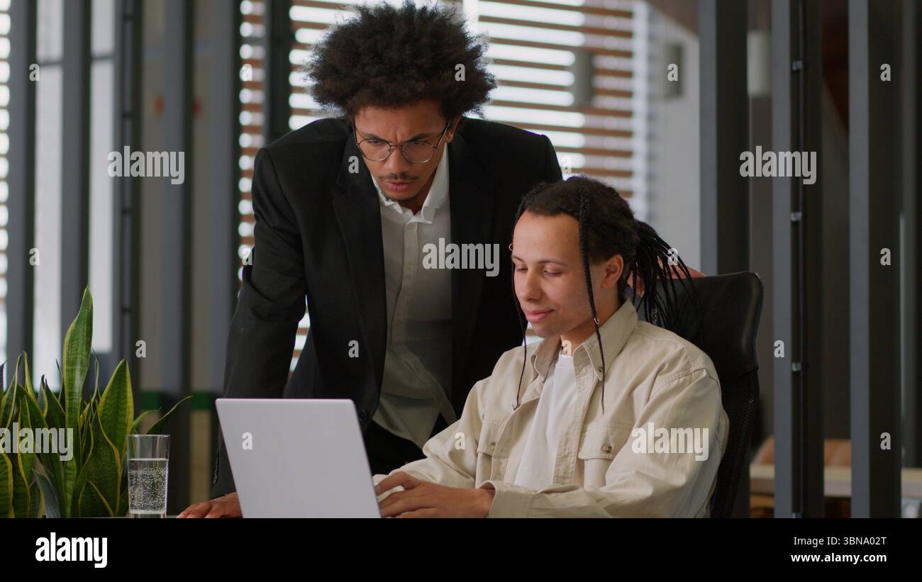 Business intern worker man working with laptop in office African ...