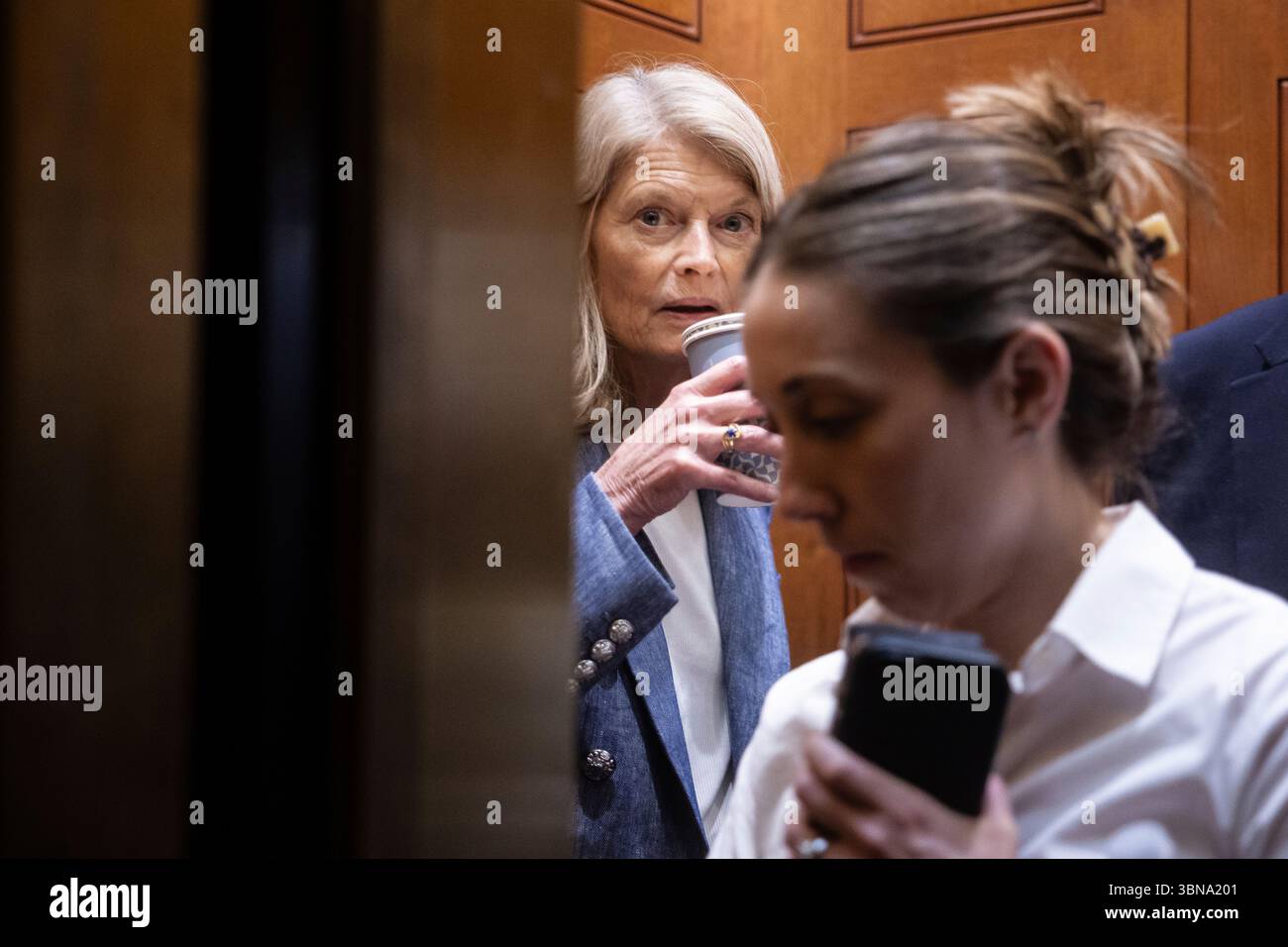 Sen. Lisa Murkowski (R-Alaska) is seen in an elevator during a series ...