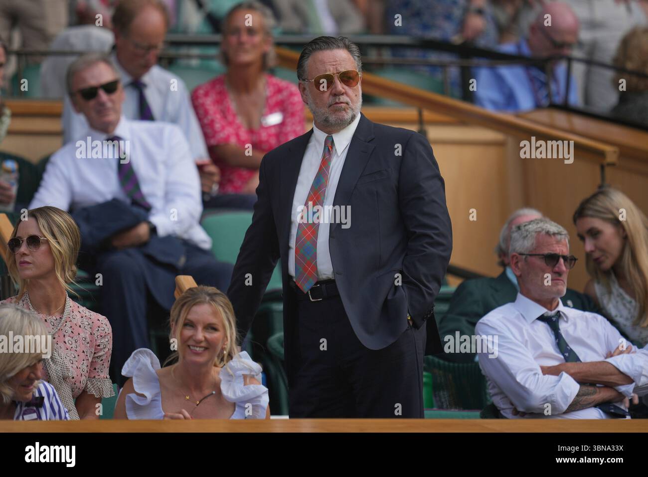 Actor Russell Crowe stands in the Royal Box on Centre Court on day two ...