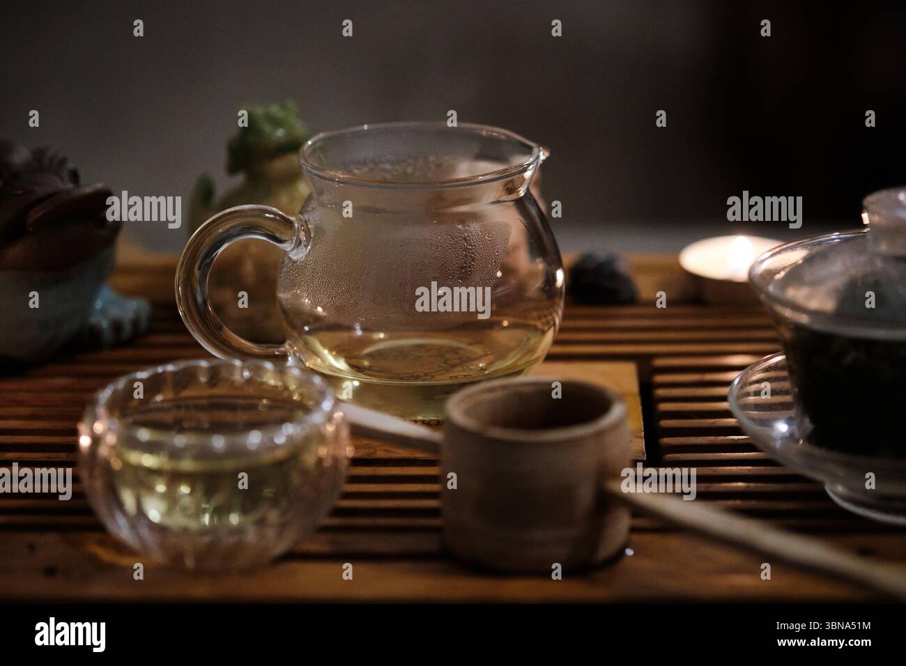Traditional tea ceremony setup with glass teapot and cup Stock Photo ...