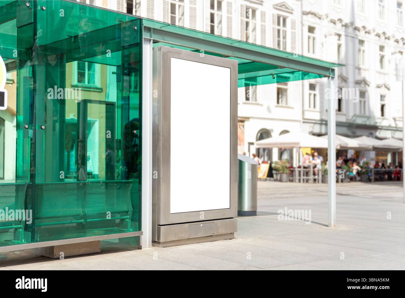 Vertical outdoor mockup at modern glass bus station with copy space ...