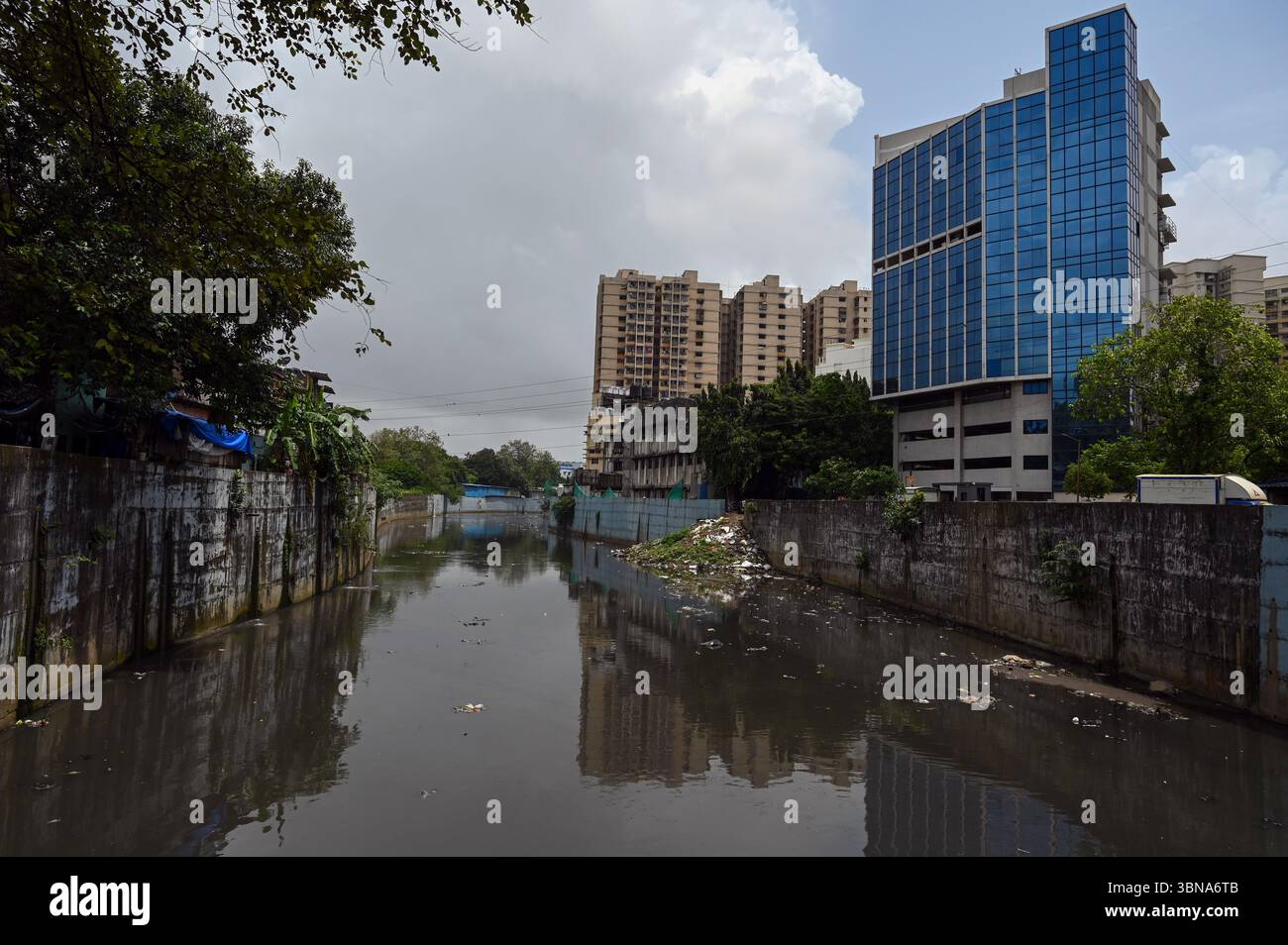 MUMBAI, INDIA - JUNE 30: View of the polluted Mithi River at the Sakinakai area on June 30, 2025 ...