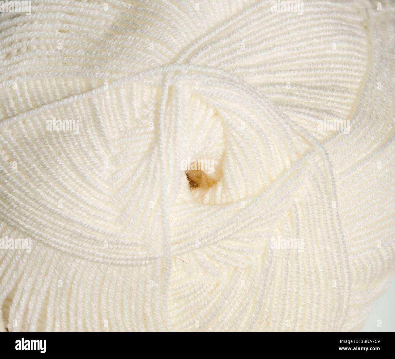 The texture of the milk yarn shows tightly twisted threads. The details ...