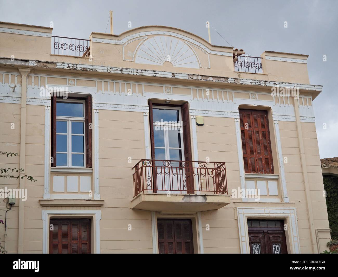 Traditional Mediterranean house facade in Athens with red architectural ...