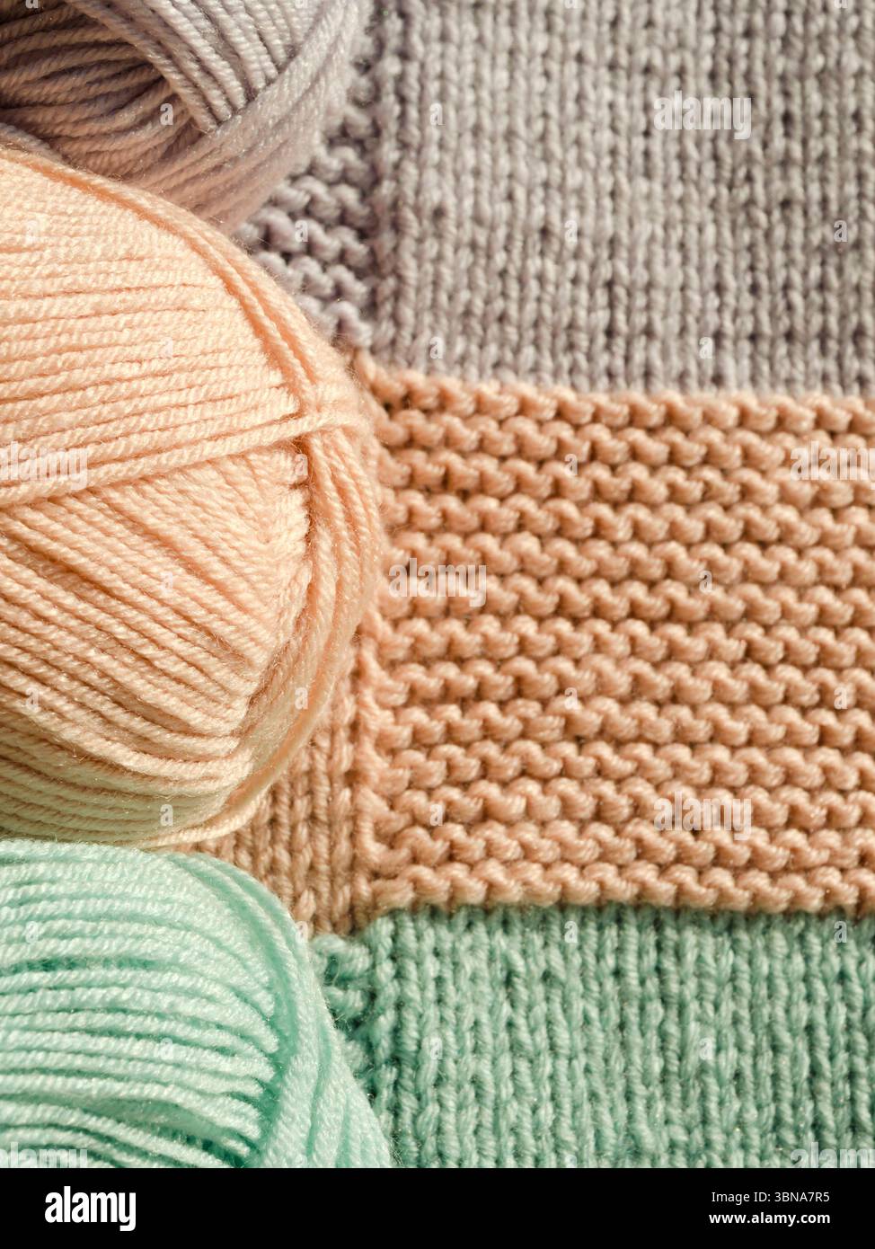 Three soft balls of yarn in peach, mint green and lavender echo the ...